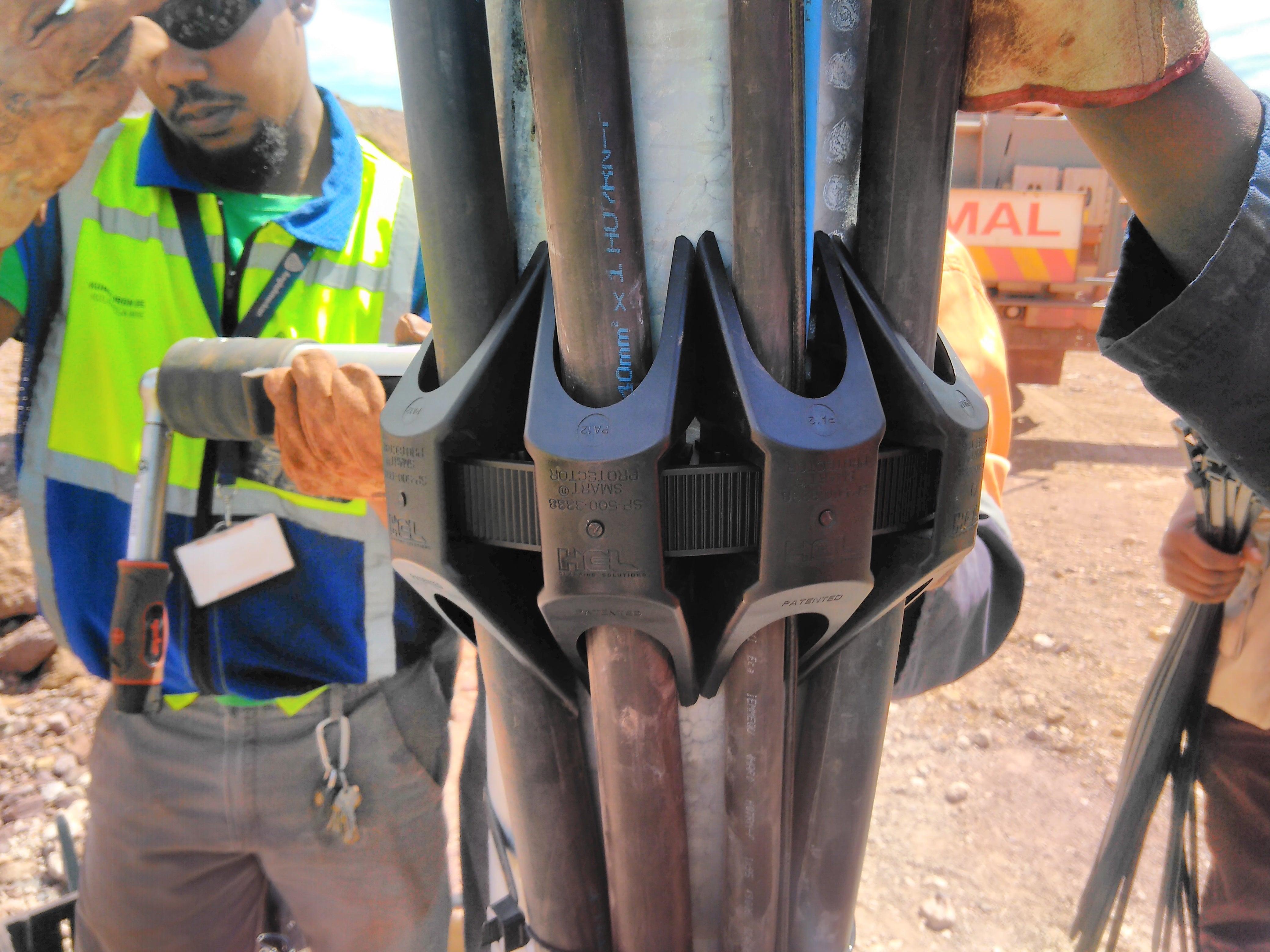Downhole Clamping: ESP Cable & Control Line Security – HCL Clamping USA